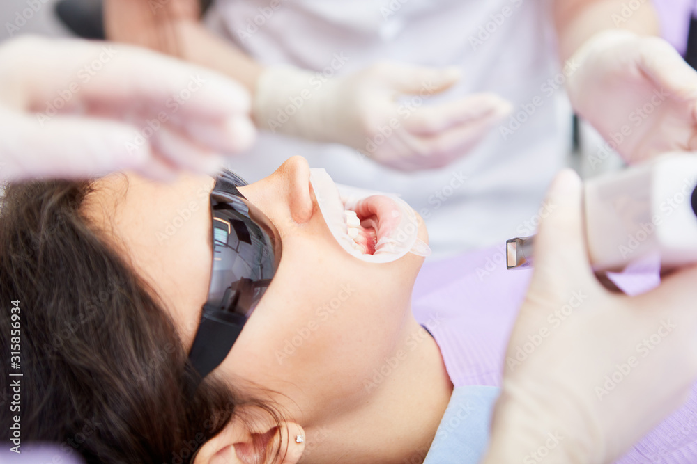 Patient with protective mask on her mouth at the dentist Stock Photo ...