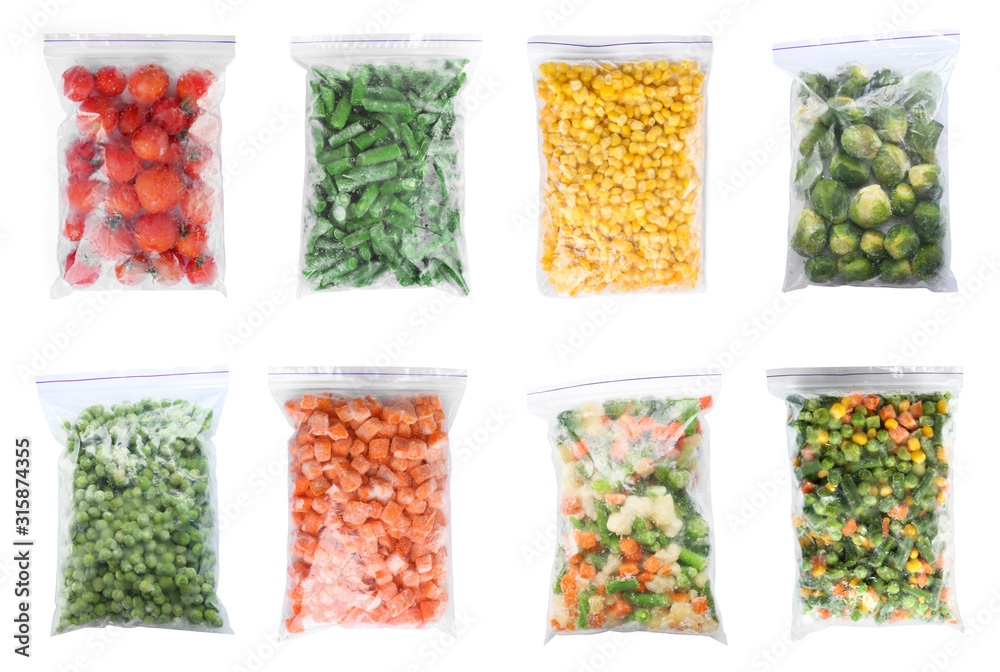 Set of different frozen vegetables in plastic bags on white background ...