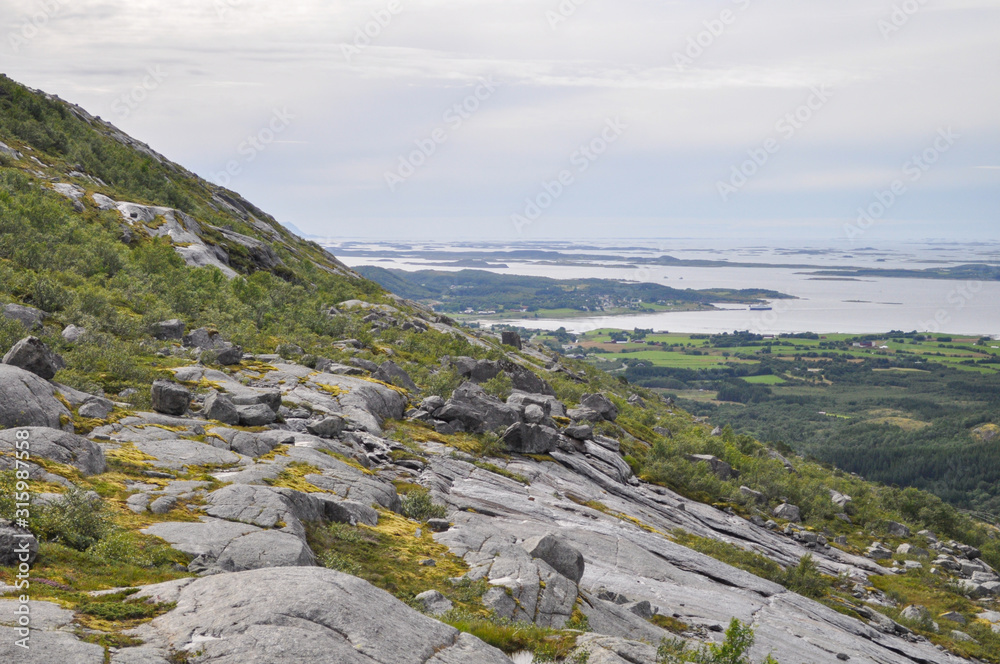 Foto de View to grey granite cliffs of Seven Sister mountains against ...