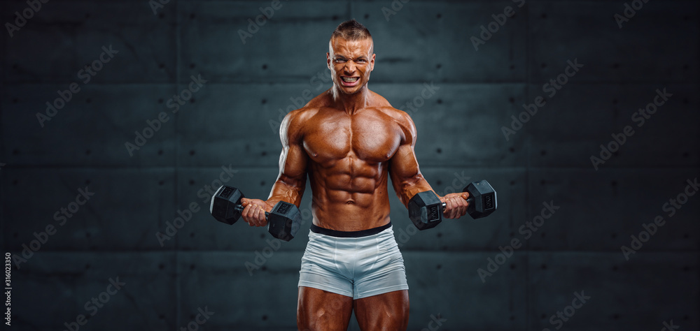 Bodybuilder Doing Dumbbell Bicep Curls. Studio Shot. Copy Space Stock ...