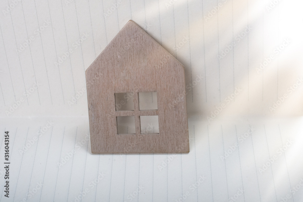 Wooden house shape with a wall and window Stock Photo | Adobe Stock