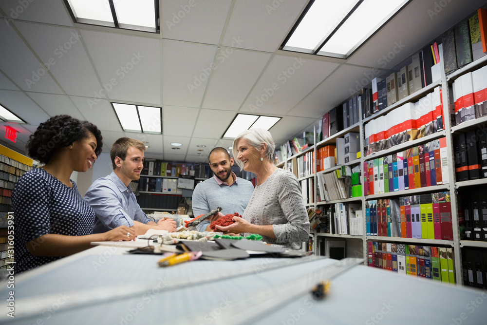 Interior designers brainstorming with swatches in meeting Stock Photo ...