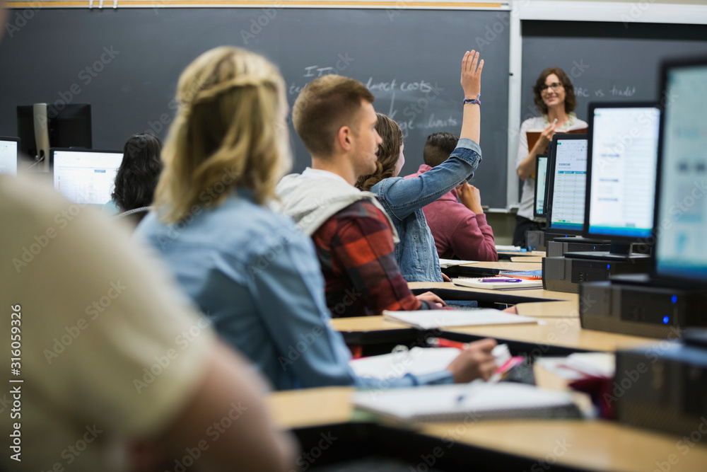College student asking question in computer lab classroom Stock Photo ...