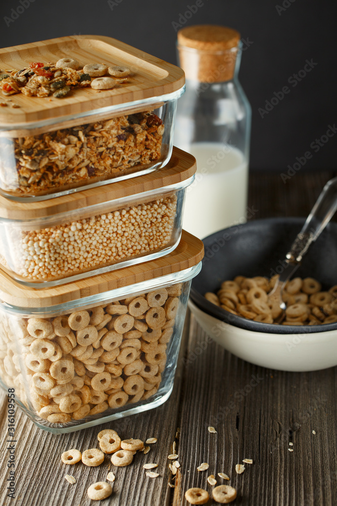 Breakfast cereal. Glass boxes with granola, cereal rings and Quinoa ...