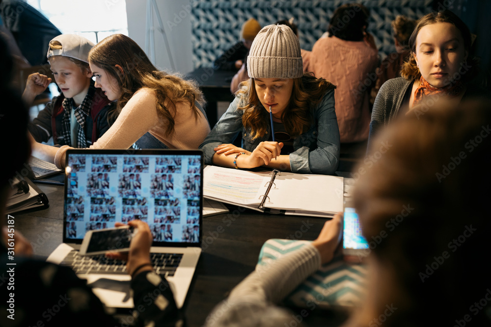 Focused high school girl student studying notes in cafe Stock Photo ...