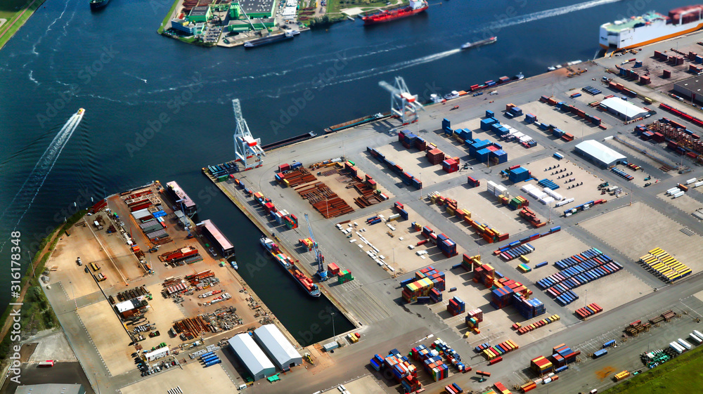aerial shot of port docks and containers for transportation and port ...
