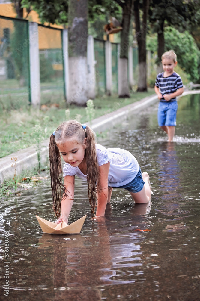 Kids Playing In The Rain