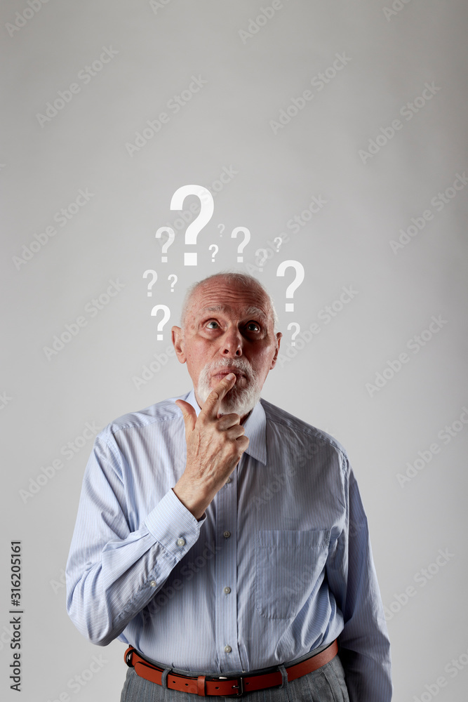 Old man and question marks. Dementia and ignorance. Confused old man ...