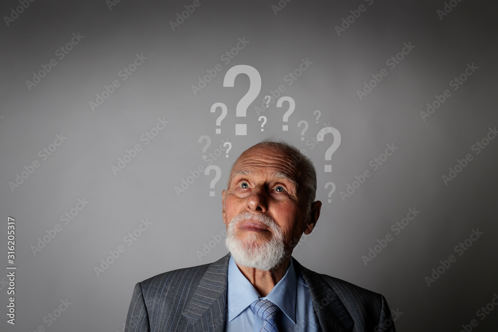 Old man and question marks. Dementia and ignorance. Confused old man ...