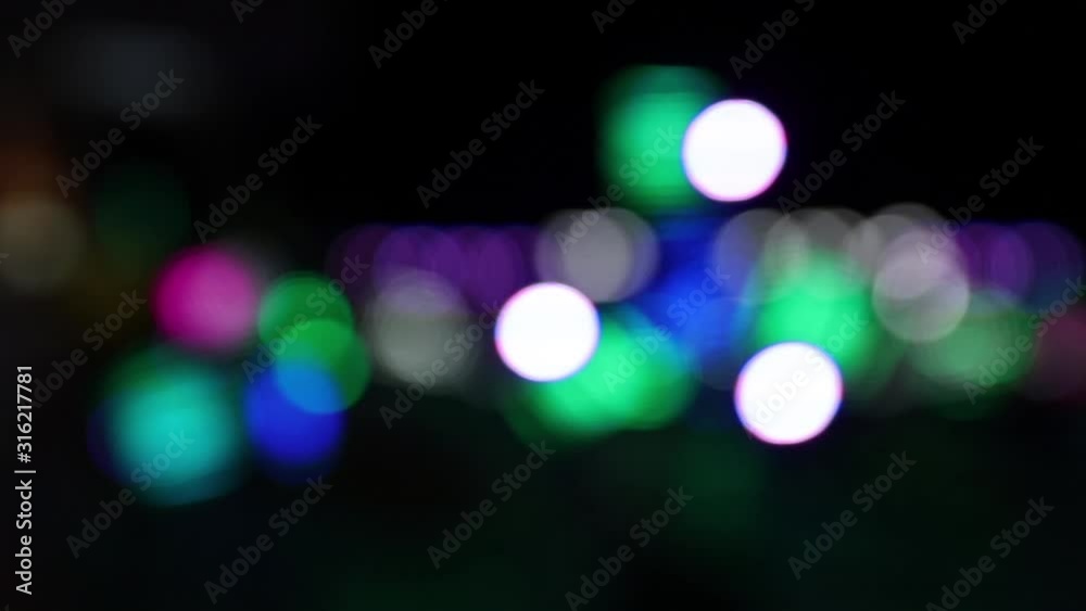 Colorful blurry lights of a moving carousel ride at night Stock Video ...