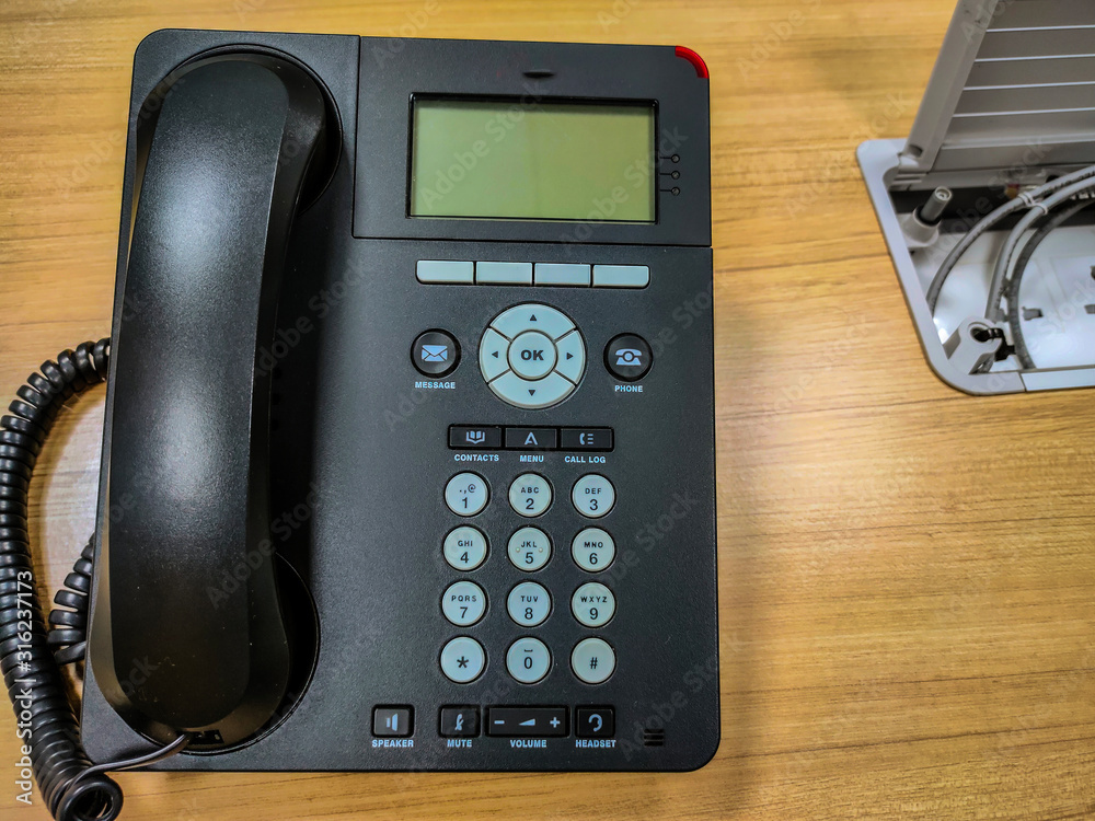 Stock photo of black color telephone devices with handset on-hook kept ...