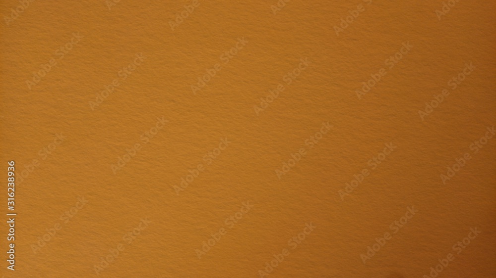 Ocher color background. Colored paper dimly lit in the middle. Light ...