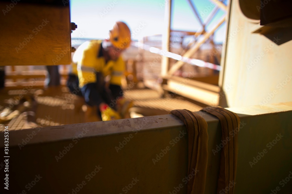 Defocused rigger picture wearing safety fall protection helmet dress ...