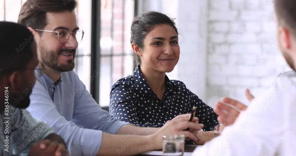 Smiling indian hr member talking to job applicant during interview ...
