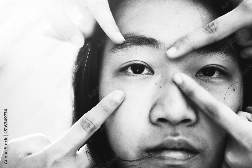 finger pointing on girl’s eye, A child being bullied by a group of ...