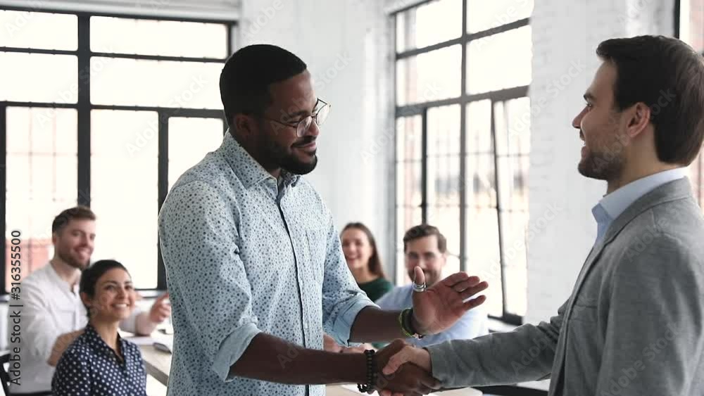 Proud confident african male professional get promoted handshake boss ...
