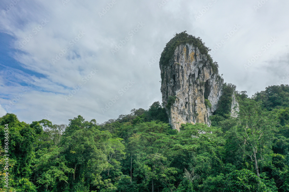 Aerial view of legendary Batu Punggul Pinnacle located at the middle of ...