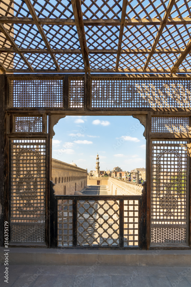 Passage surrounding the Mosque of Ibn Tulun framed by interleaved ...