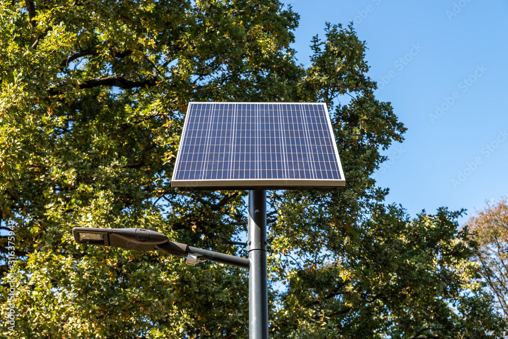 Modern new street LED light powered by solar panel with cells charging ...