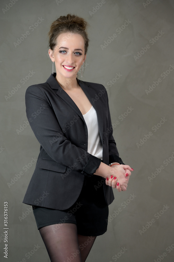 Vertical portrait of a business girl model with excellent makeup with ...