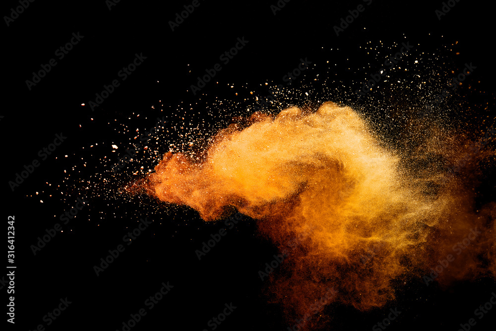 Abstract orange powder explosion isolated on black background. Stock ...