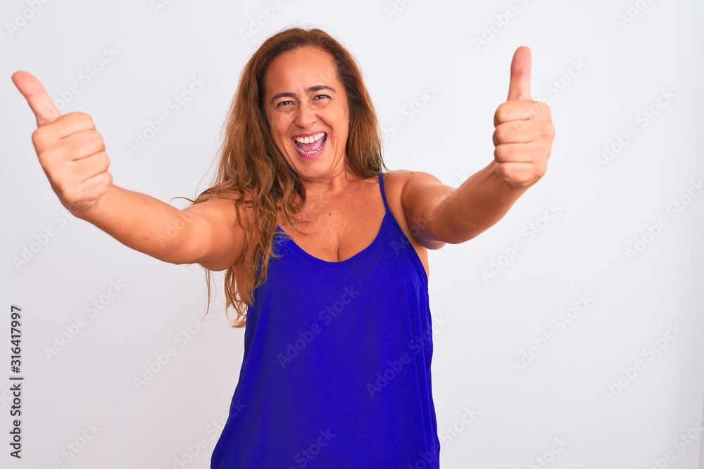 Middle age mature woman standing over white isolated background ...
