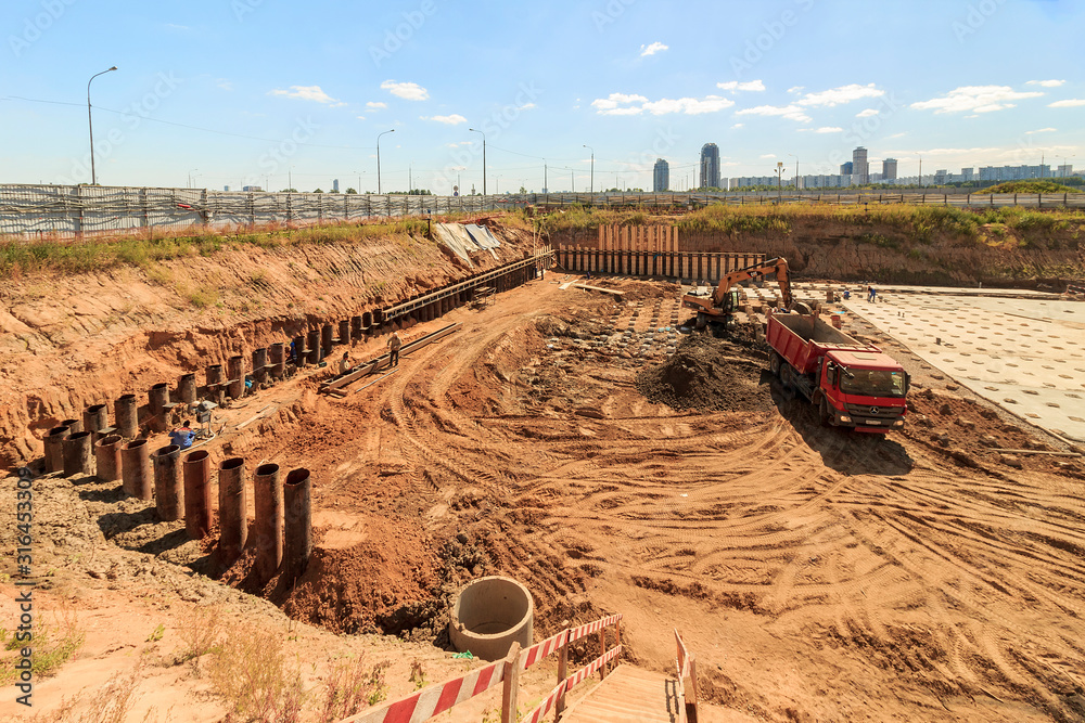Pile driving in foundation pit for construction of apartment building ...