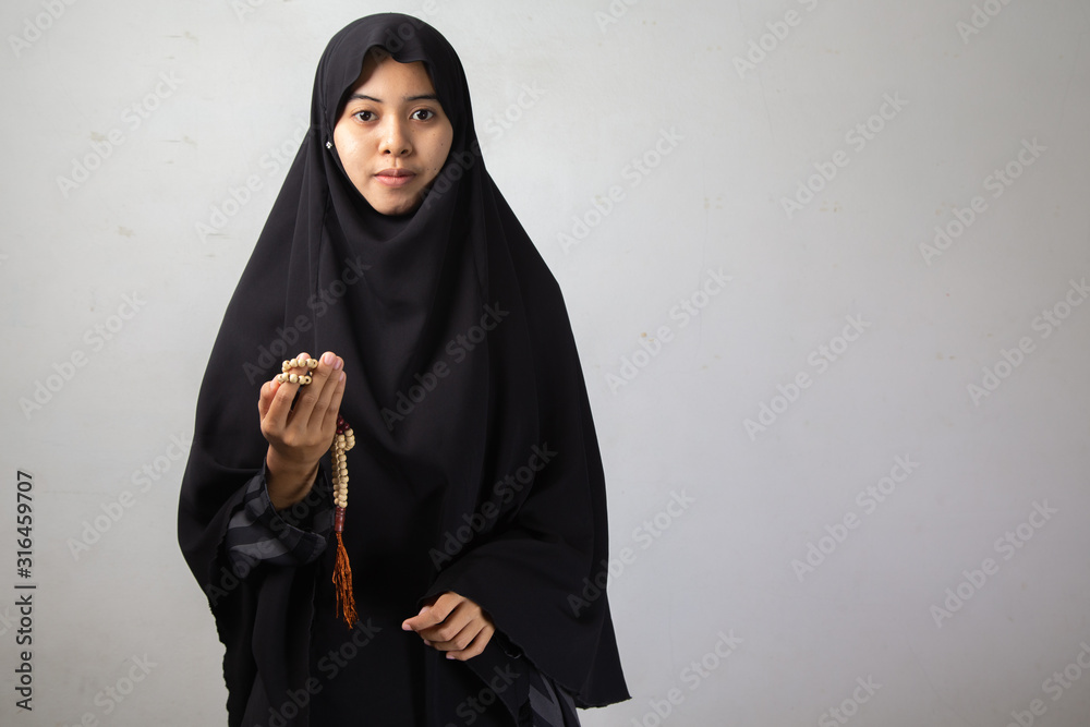 Muslim women hand holding the rosary in the mosque for prayer, In the ...