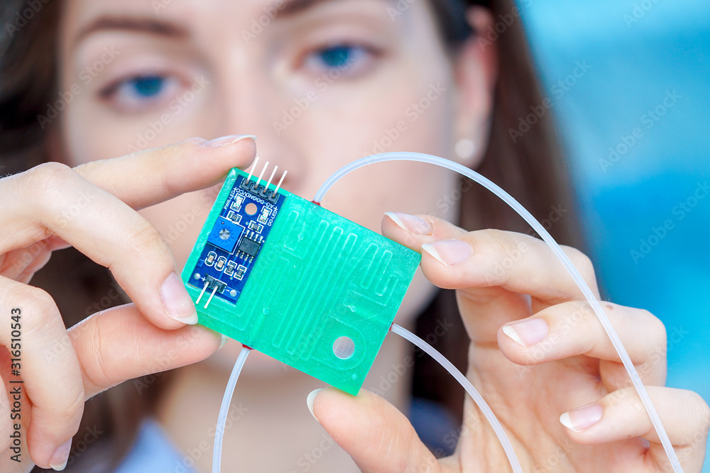 Girl holding polymers Bio-MEMS biomedical microelectromechanical ...