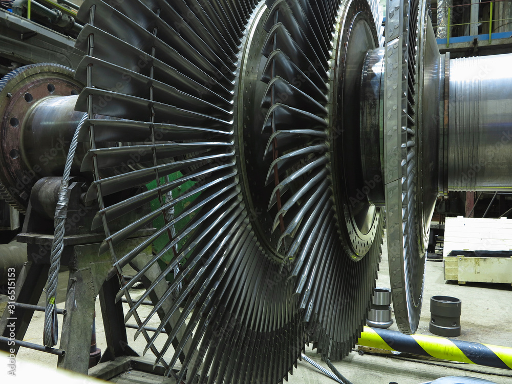 Power generator steam turbine in repair process, machinery, pipes ...