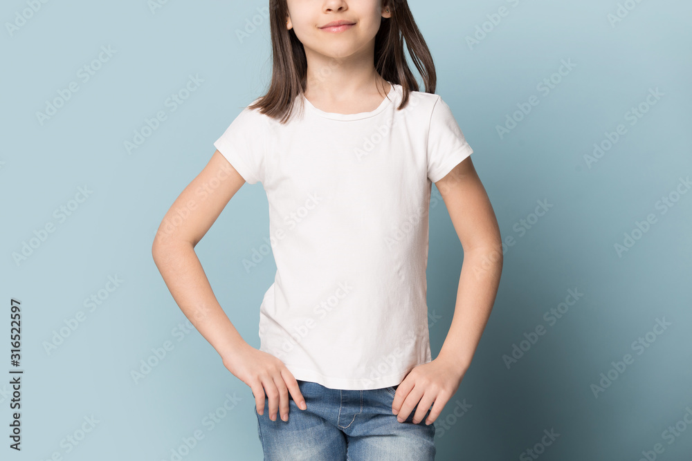 Preschool girl demonstrating white blank mock up copy space t-shirt ...