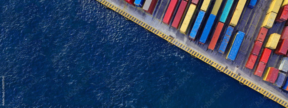 Aerial drone ultra wide top down photo of commercial container terminal ...