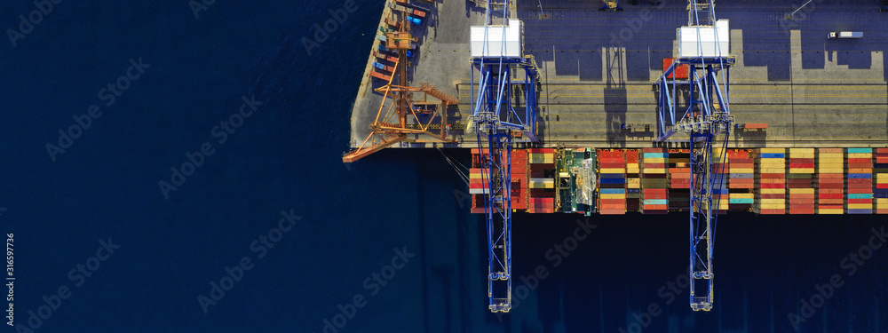 Aerial drone ultra wide top down photo of commercial container terminal ...
