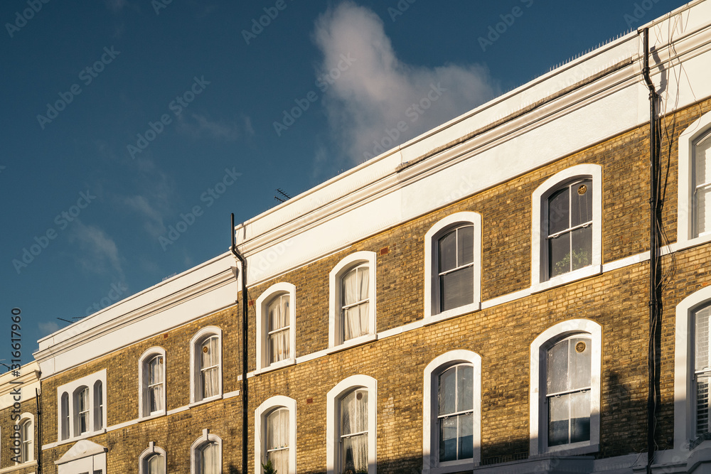 Nice windows or balconies an exclusive mews with white small houses in ...