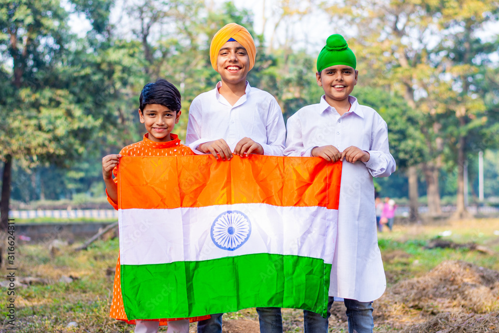 Happy Indian kids holding Indian National flag. Indian Kids celebrating ...