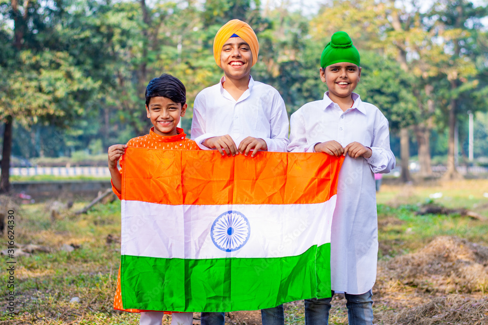 Happy Indian kids holding Indian National flag. Indian Kids celebrating ...