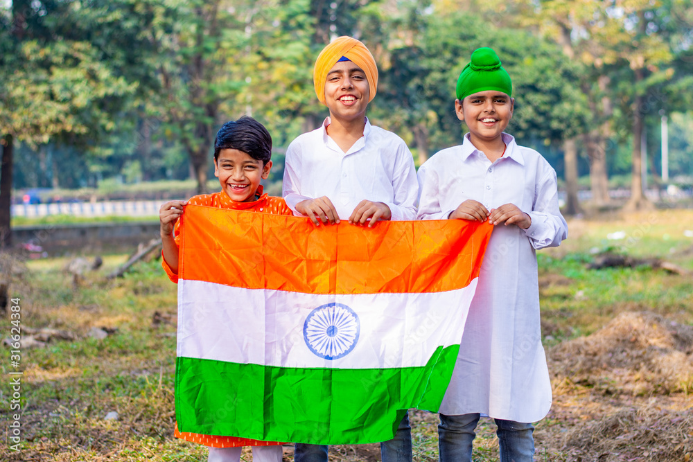 Happy Indian kids holding Indian National flag. Indian Kids celebrating ...