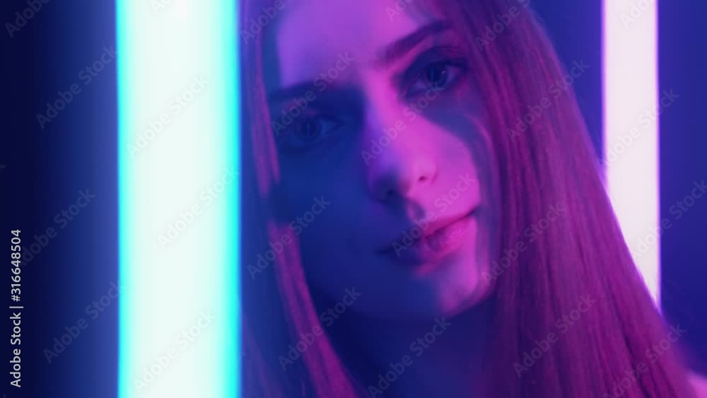 Neon girl portrait. Feminine beauty. Tender relaxed woman in purple ...
