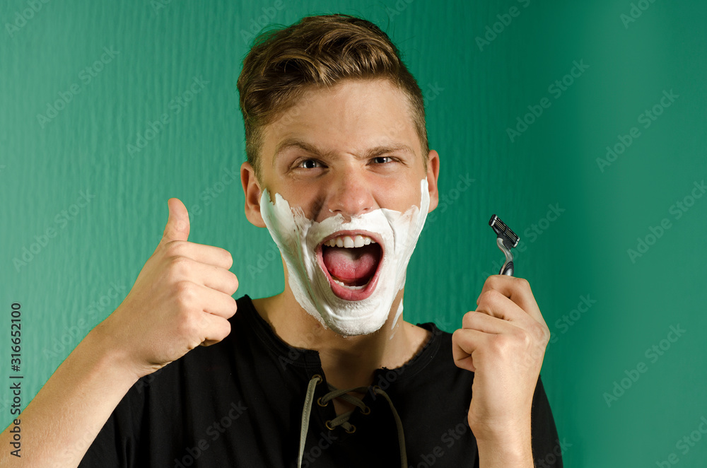 Puberty male showing thumbs up, having his first shave Stock Photo ...