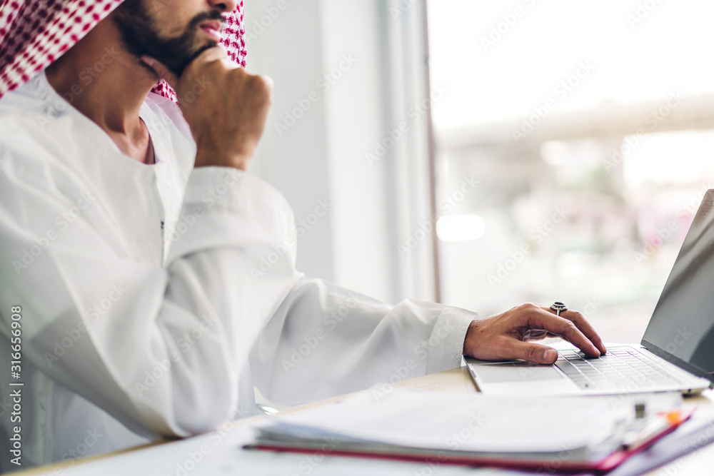 Arabic businessman working with laptop computer.creative arab business ...