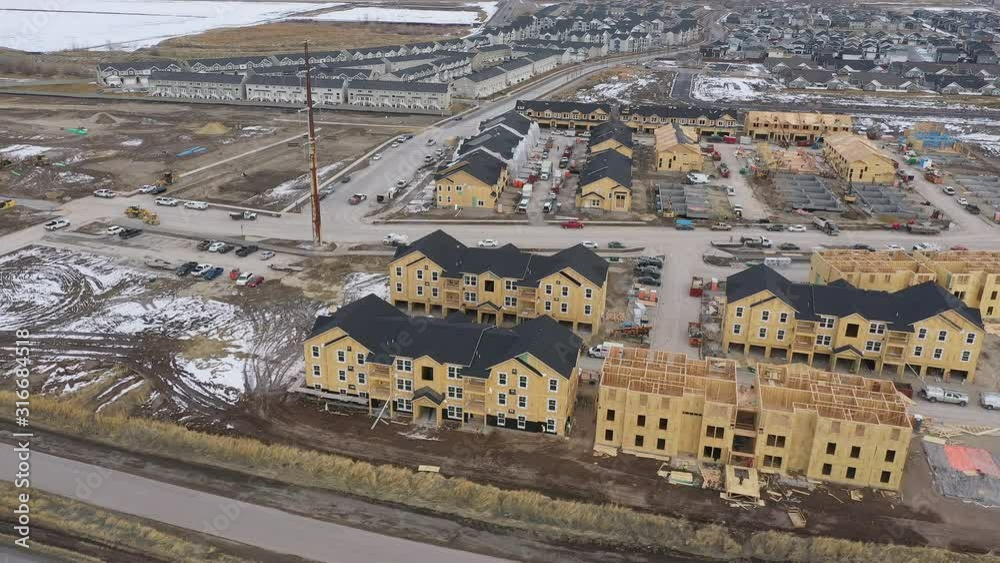 Construction of new housing development taking over empty land which ...