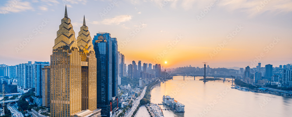 Dusk view of golden high-rise buildings along the Yangtze River in ...