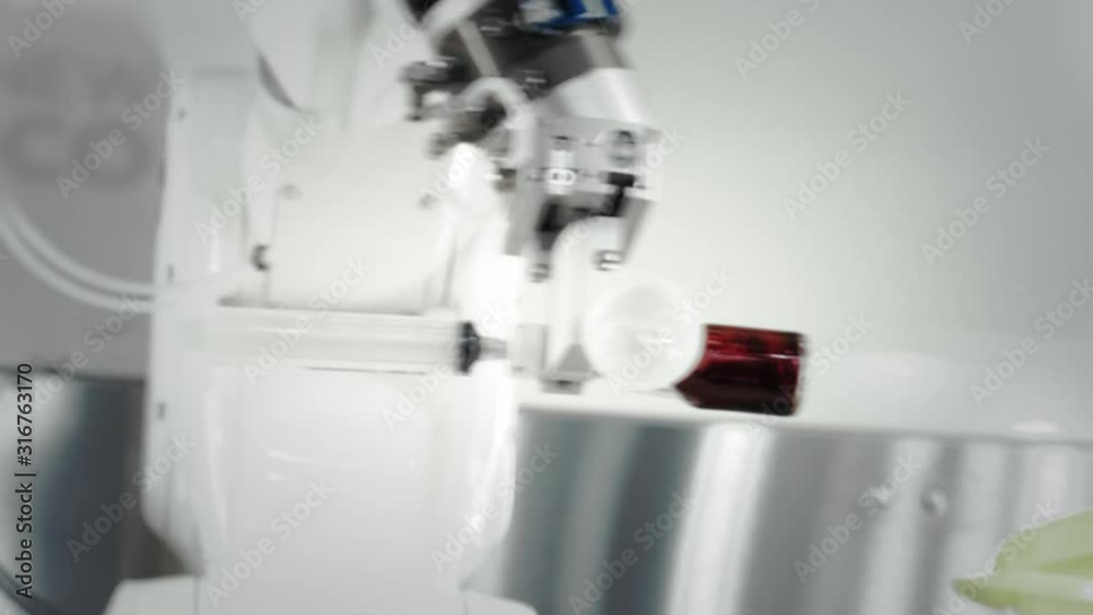 The innovative arms of a robotic arm make an injection of chemotherapy ...