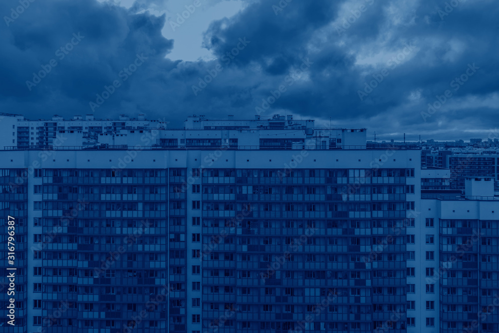 Color of the year 2020 classic blue. Facade of high-rise multi-storied ...