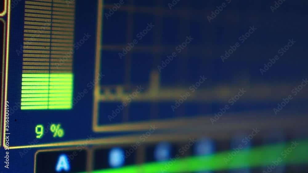 Graph scrolling past with a percentage indicator on a screen to ...