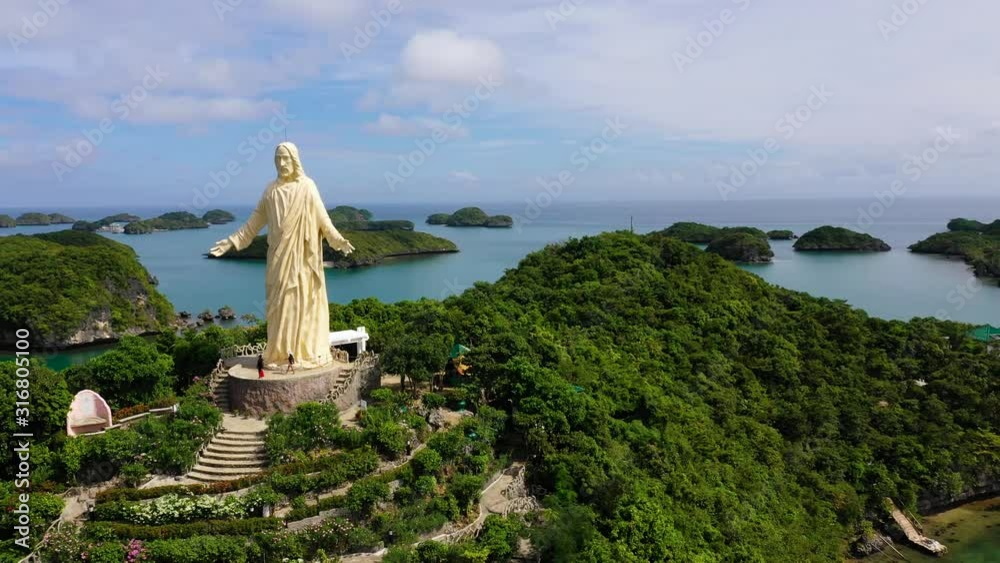 Aerial view of the hundred Islands national Park and the statue of ...