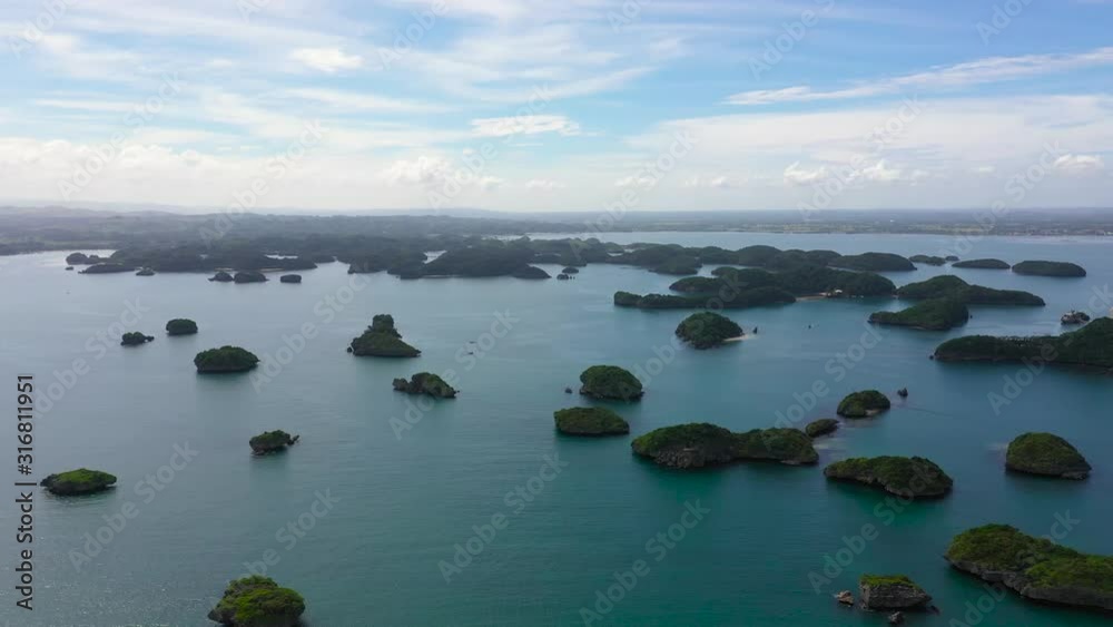 Seascape with a cluster of tropical Islands in turquoise water, aerial ...