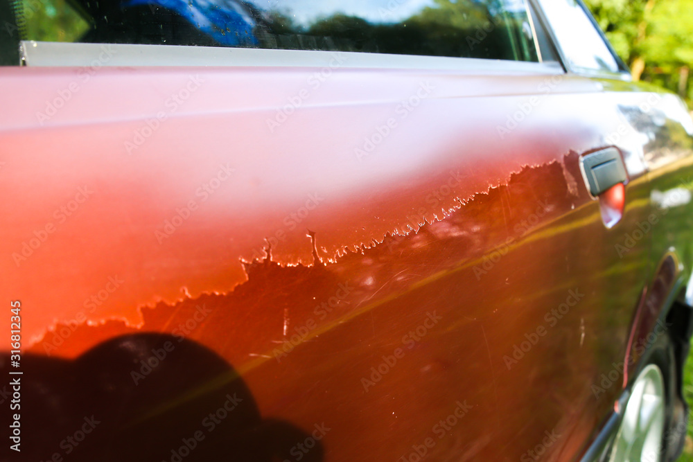 Old car with scratches on the hood. Peeled paint on vehicle. Stock ...