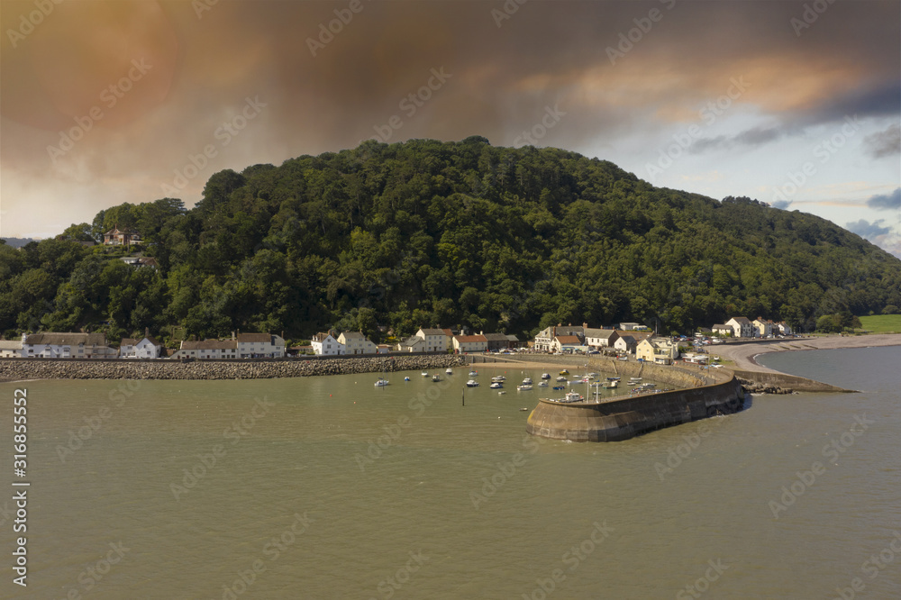 Minehead harbour aerial view from the ocean with boats and harbour wall ...