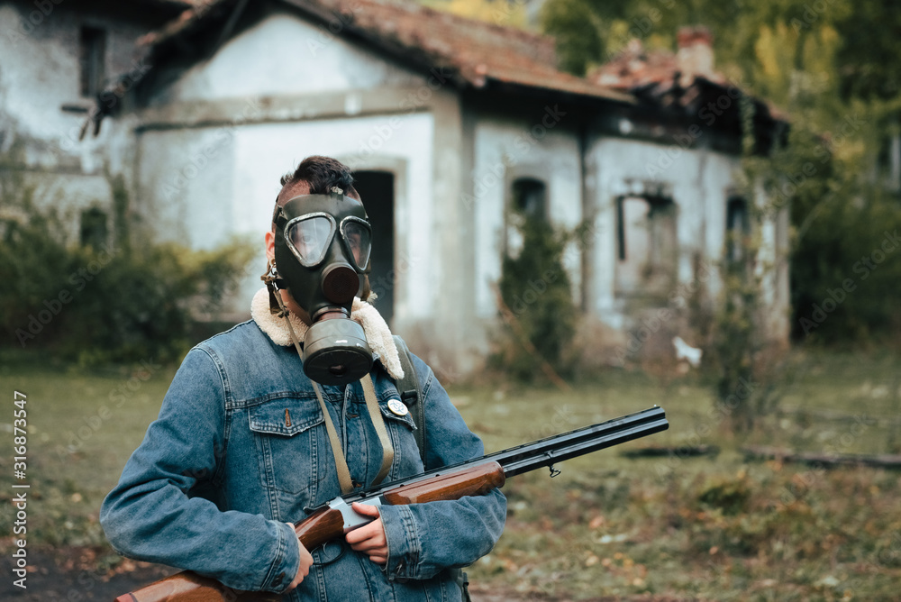woman with punk style, with gas mask, backpack and double barrel ...